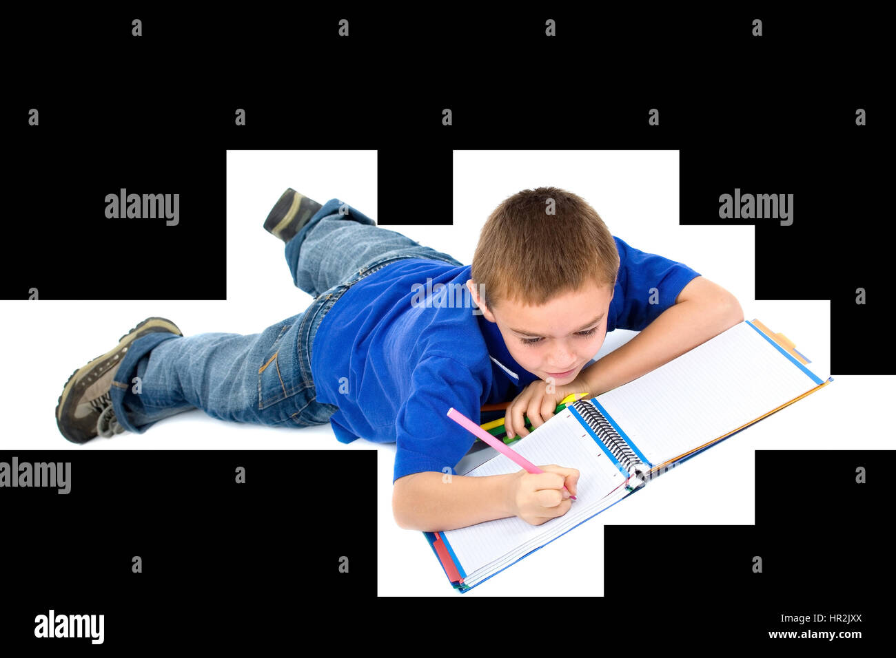 school boy doing homework on the floor isolated over a white background ...