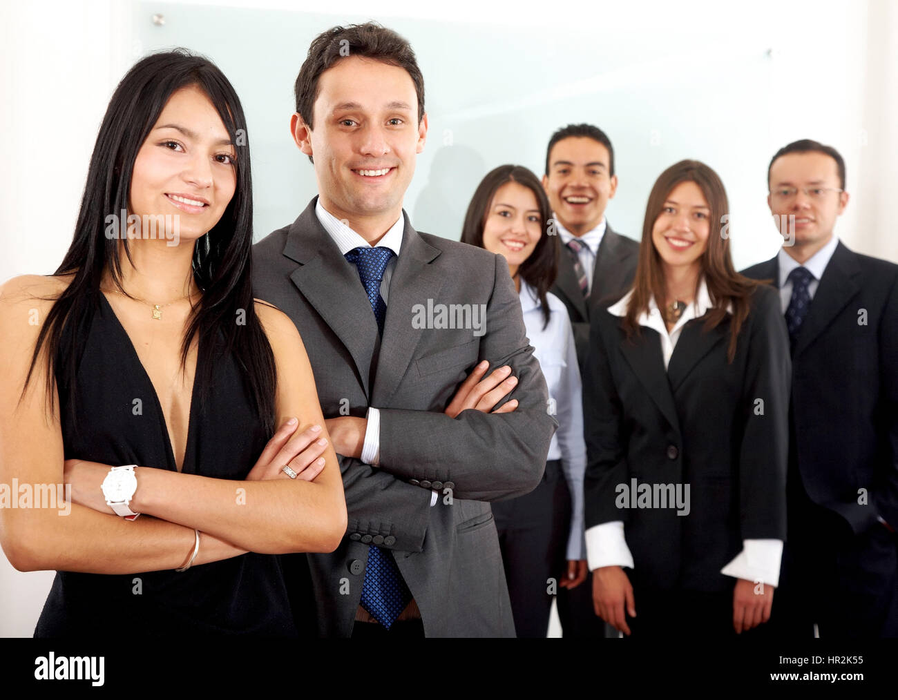 Business team in an office with a businesswoman and a businessman ...