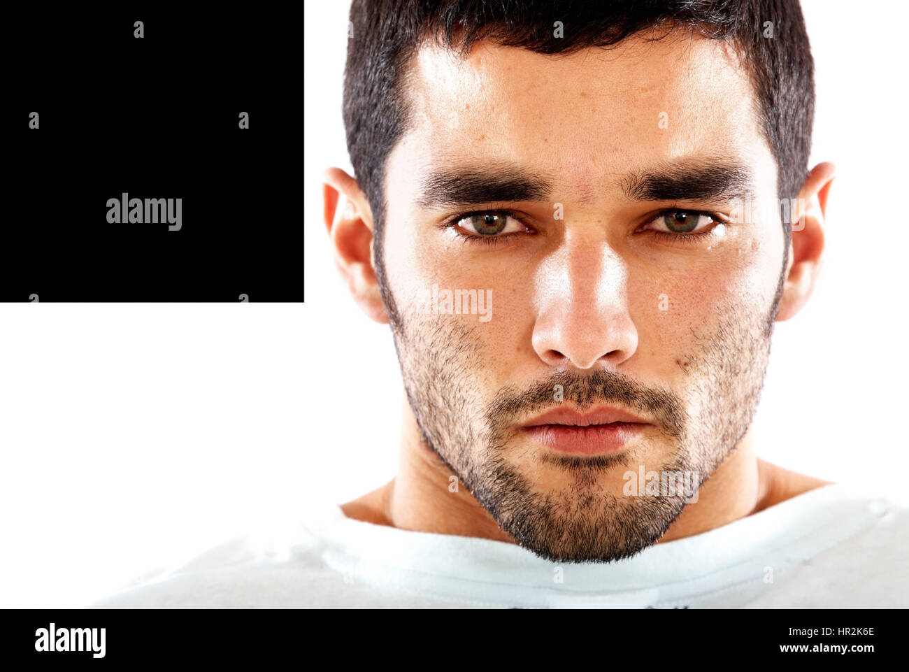 fashion male portrait with a very agressive and intense stare ...