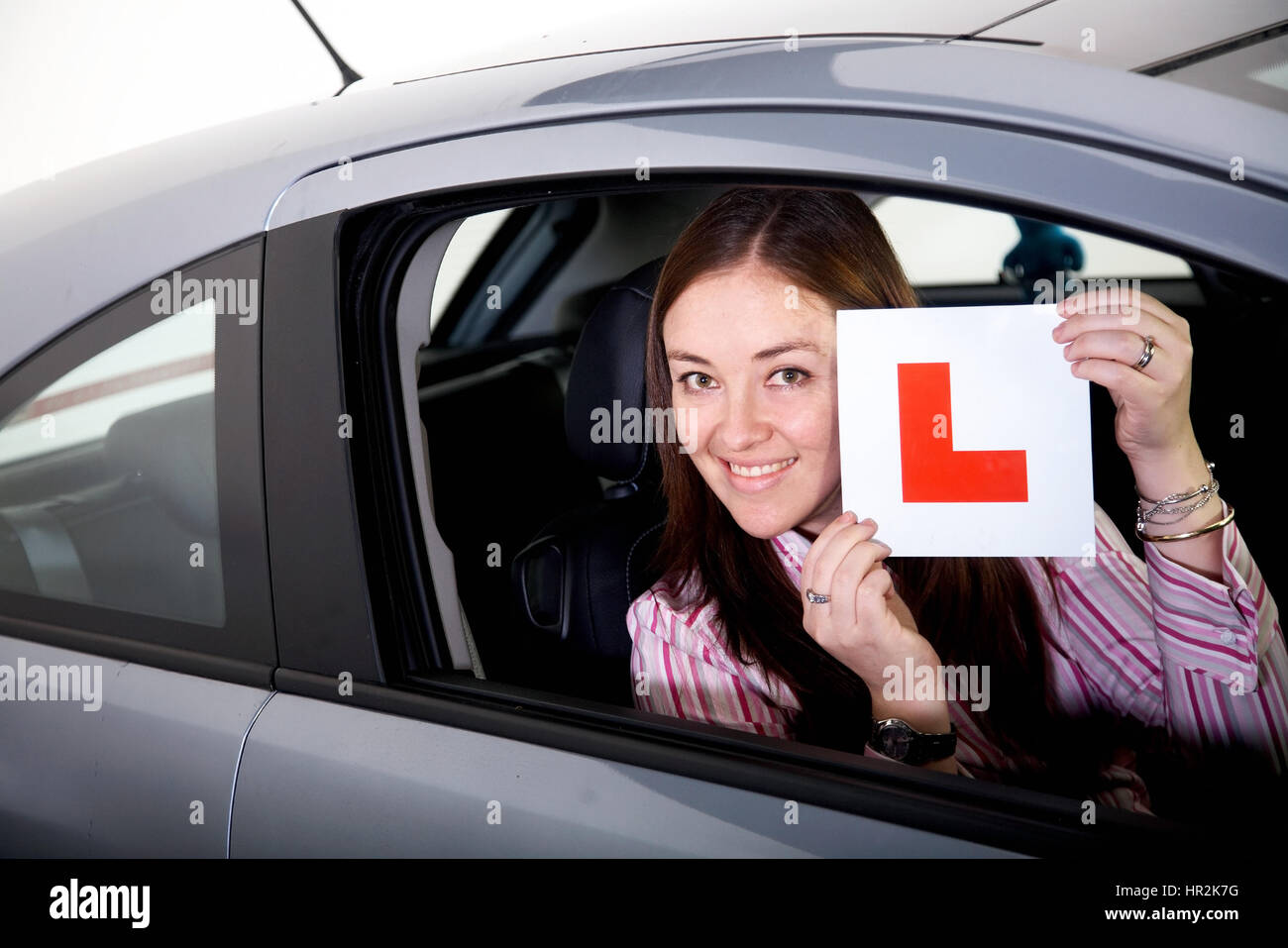 female inside a car learning to drive - studio Stock Photo - Alamy