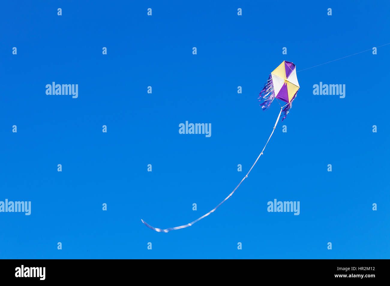 Kite in the blue sky Stock Photo - Alamy