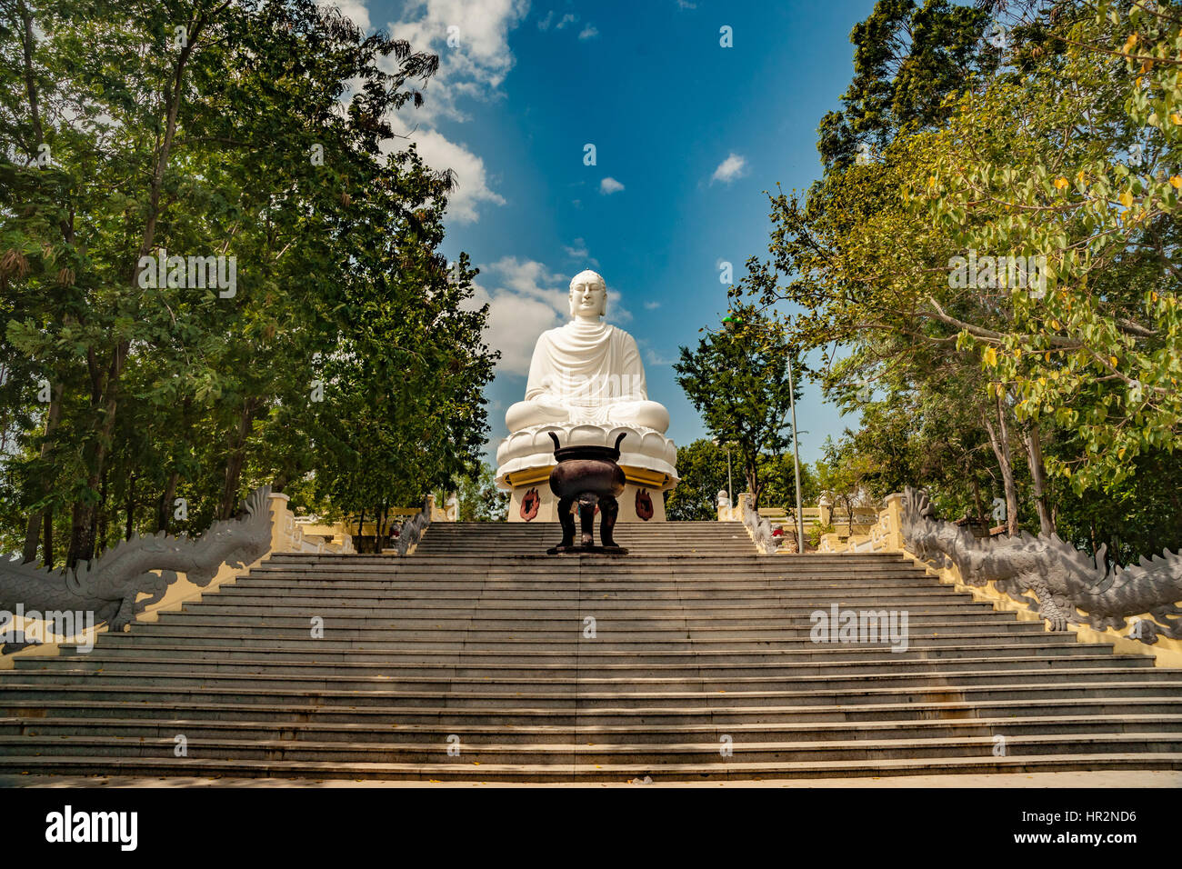 White buddha statue sits hi-res stock photography and images - Alamy