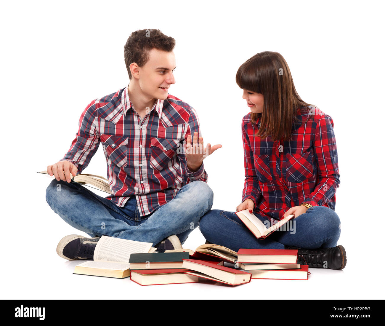 Teenage couple studying together, isolated on white background Stock ...