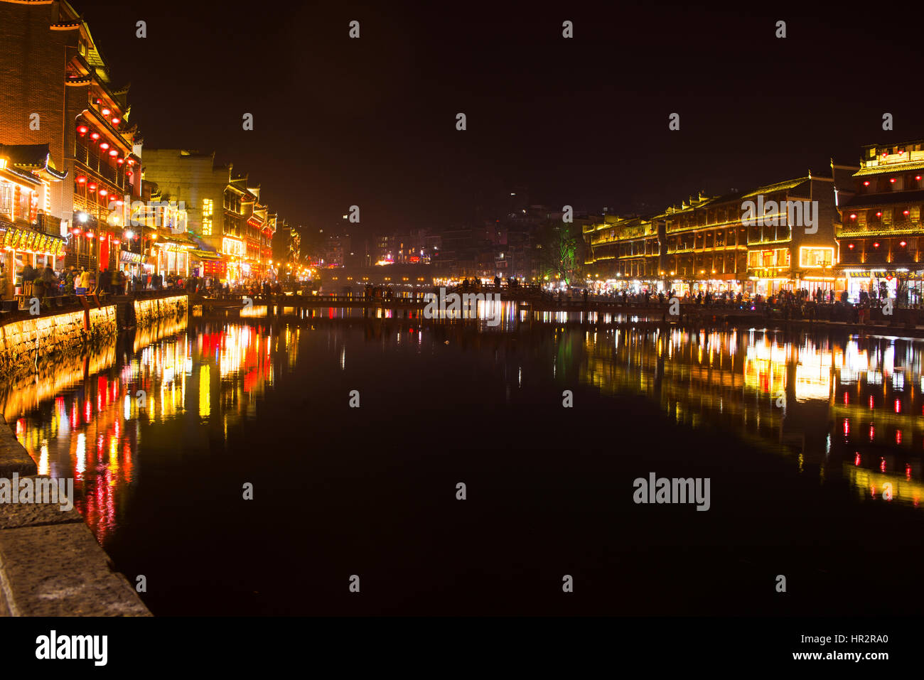 Fenghuang Ancient City streets at night.In tuojiang river on both sides ...
