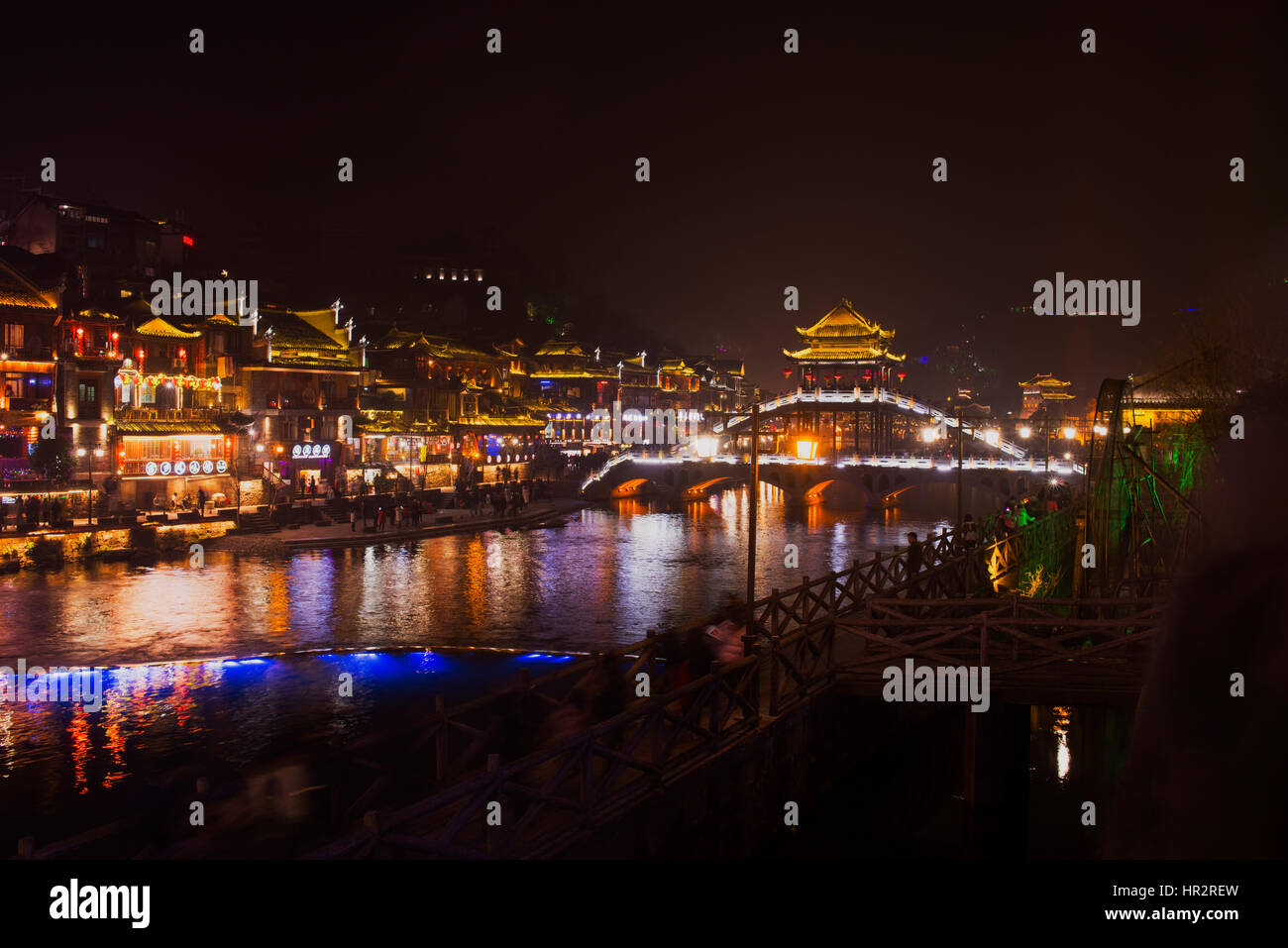 Fenghuang Ancient City streets at night.In tuojiang river on both sides ...
