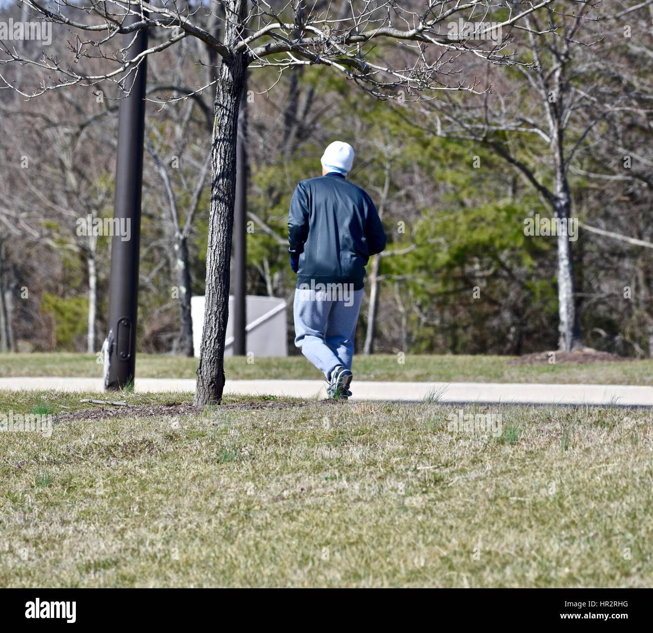 Man running through park hi-res stock photography and images - Alamy