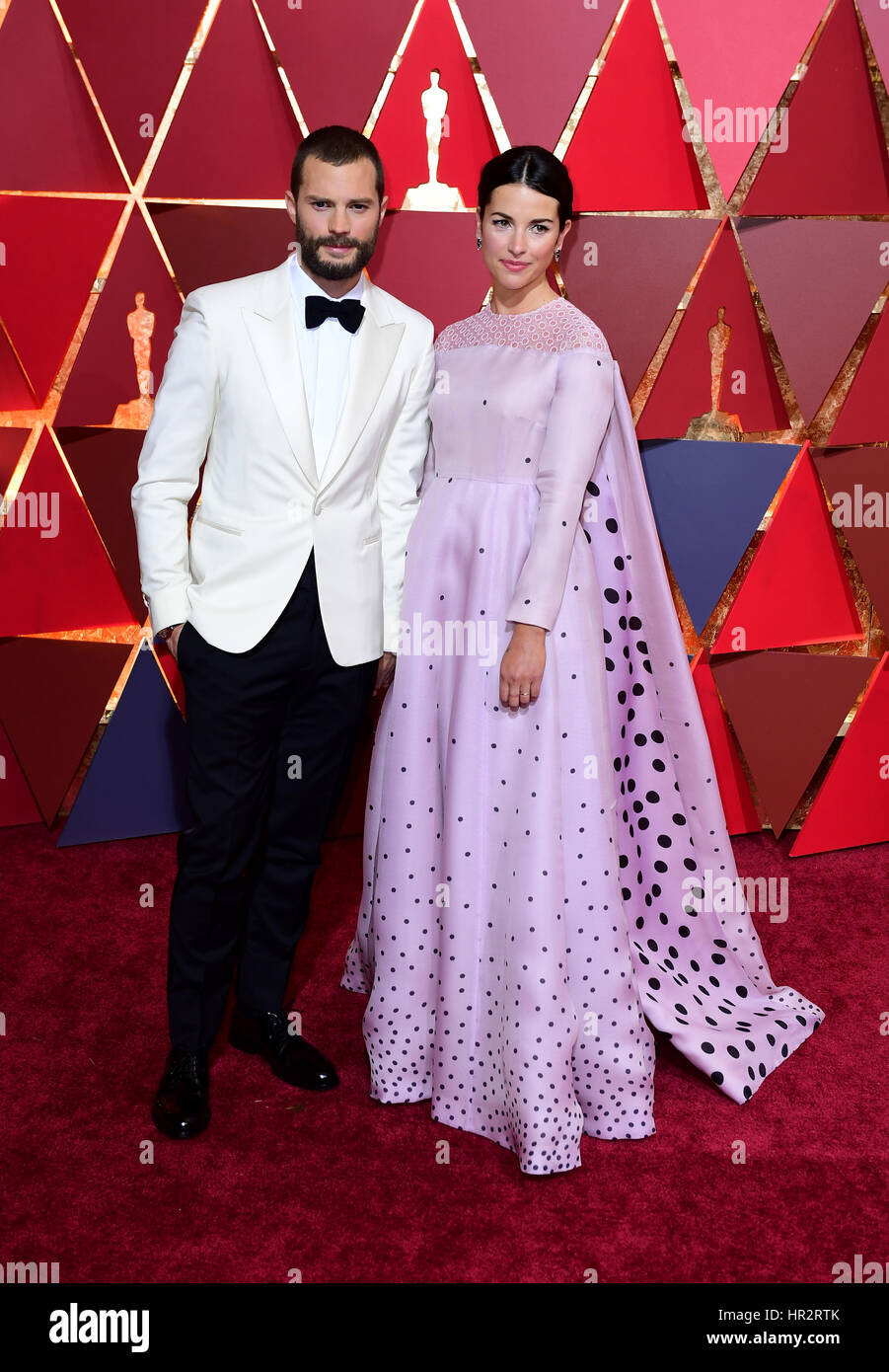 Jamie Dornan and Amelia Warner arriving at the 89th Academy Awards held ...
