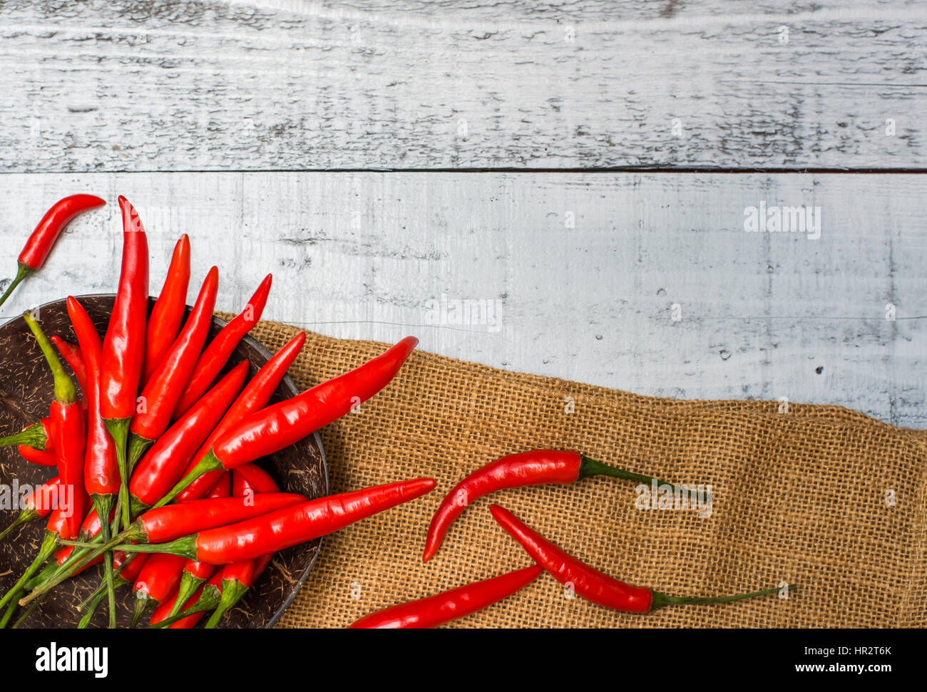 Hot and spicy red chilli on wood table background Stock Photo - Alamy
