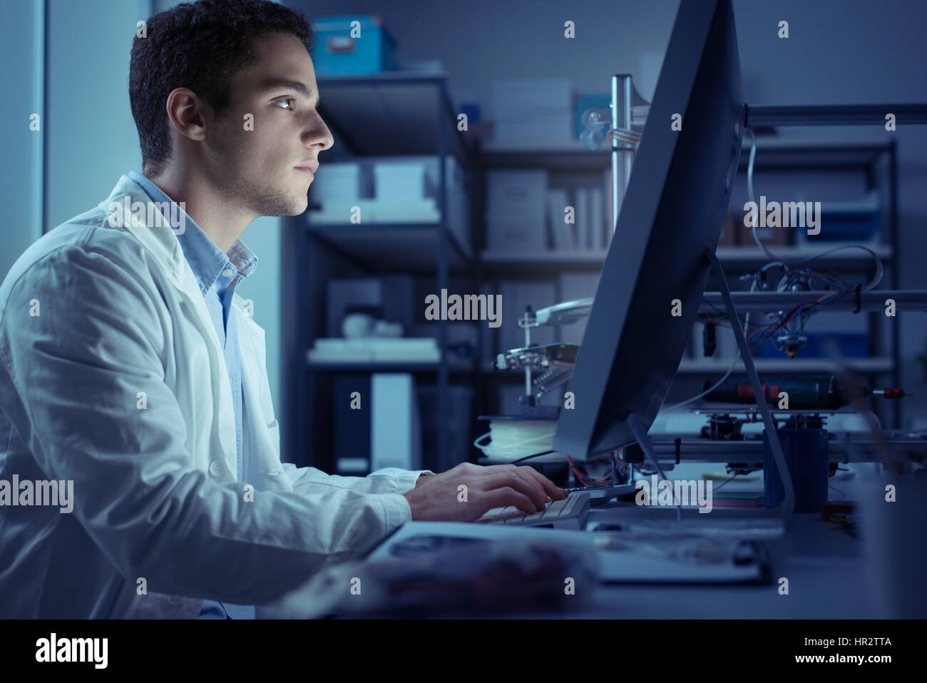 Confident engineering student working in the laboratory and using a ...