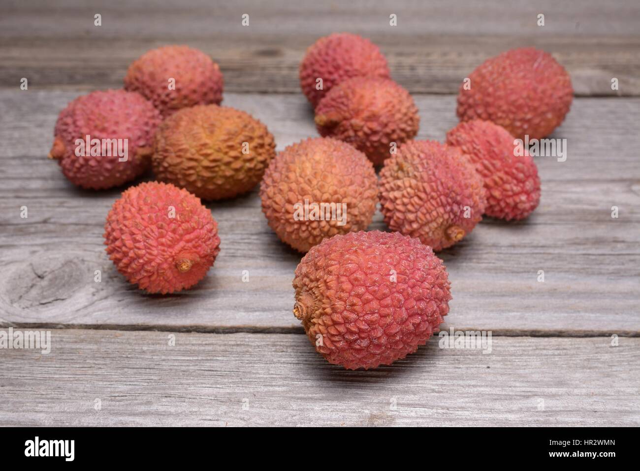 Lychee, Fresh lychee and peeled showing the red skin and white flesh ...