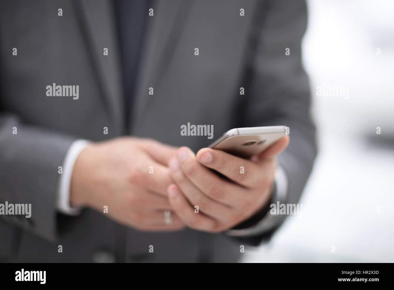 man holding device and touching screen Of his phone Stock Photo - Alamy