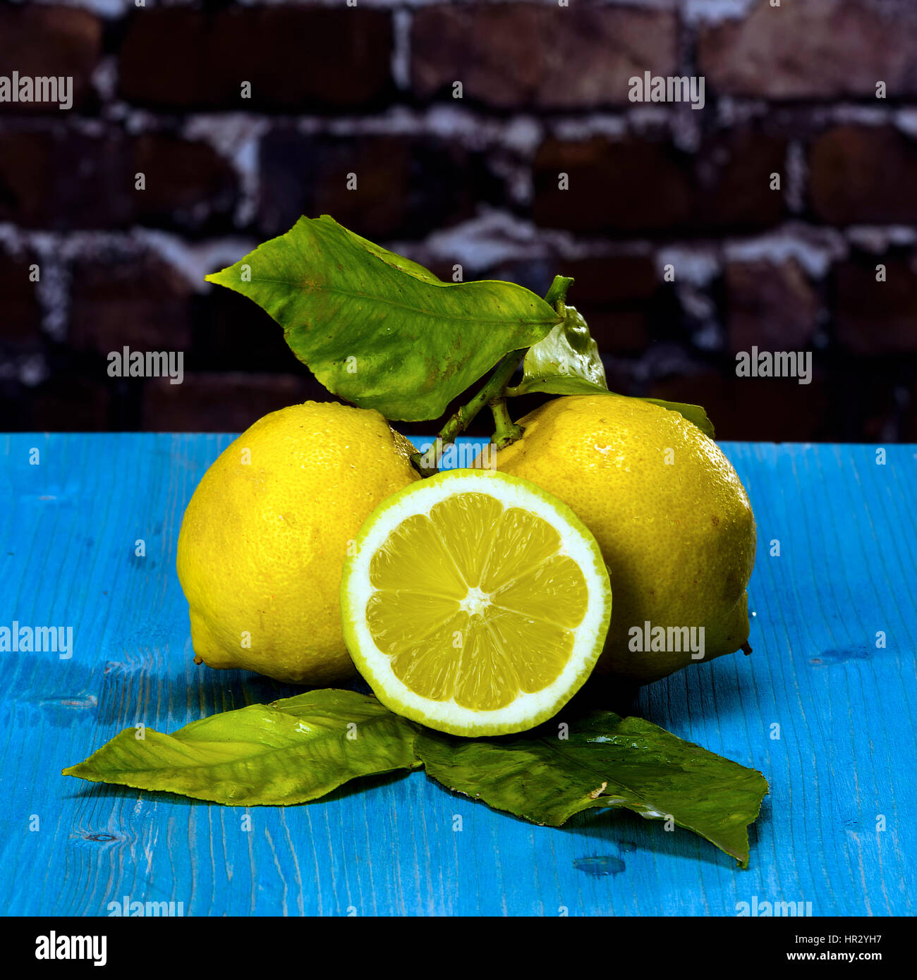 Acid and yellow fruit. Lemons on a blue wood, stock photo Stock Photo ...