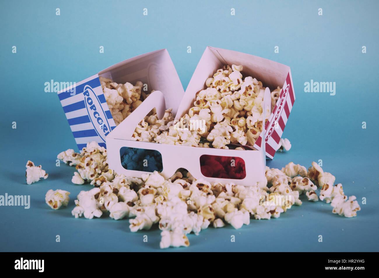 Bucket of popcorn against a blue background Vintage Retro Filter Stock ...