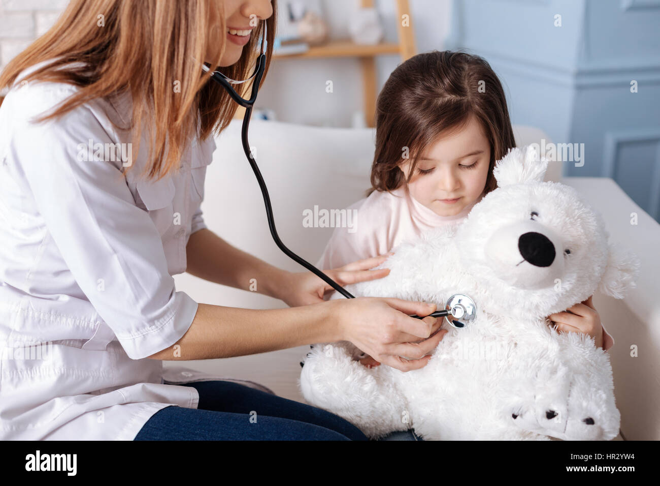 One more visit. Cheerful pleasant professional doctor examining fluffy ...