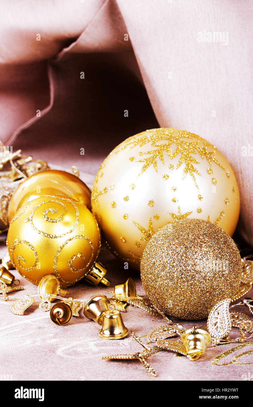 Festive gold Christmas decorations on a fabric background Stock Photo ...