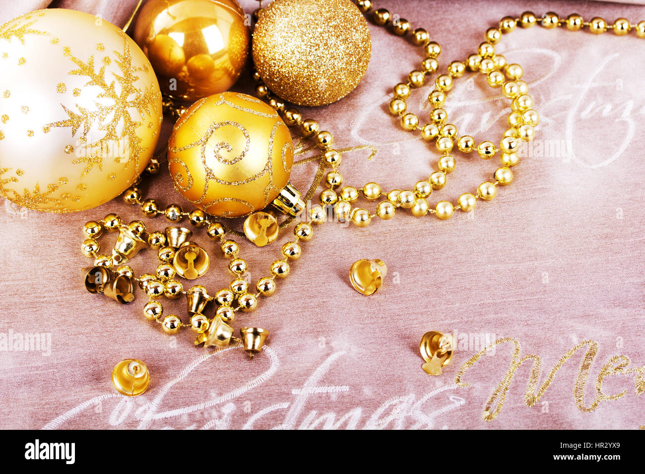 Festive gold Christmas decorations on a fabric background Stock Photo ...