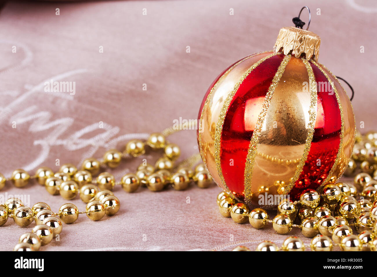 Festive gold Christmas decorations on a fabric background Stock Photo ...