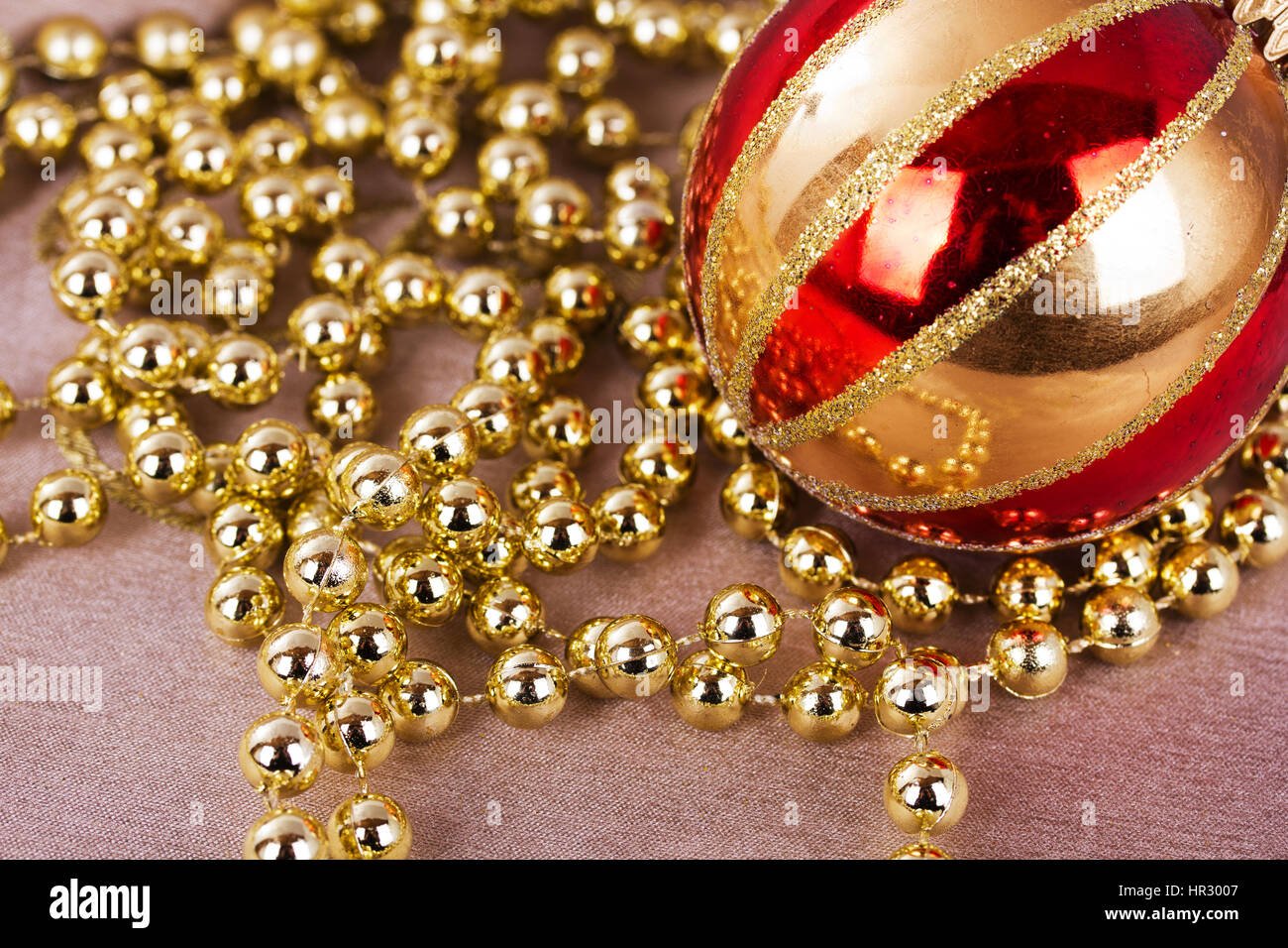 Festive gold Christmas decorations on a fabric background Stock Photo ...