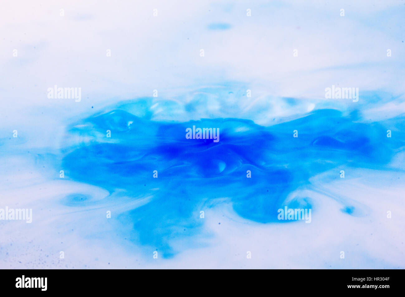 Colorful paint drop splashing on black a background Stock Photo - Alamy