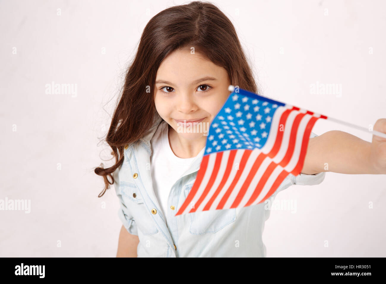 Look at my flag. Modest beautiful smiling girl holding the American ...