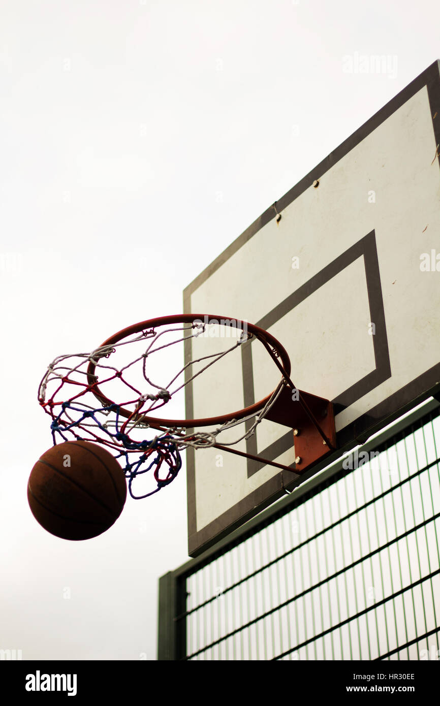 Basketball hoop outside in a school play area Stock Photo - Alamy