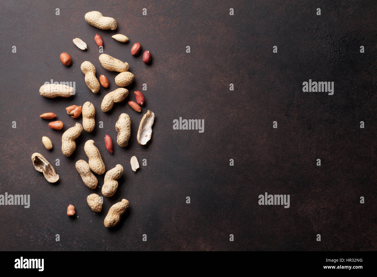 Peanuts on stone table. Top view with copy space Stock Photo - Alamy
