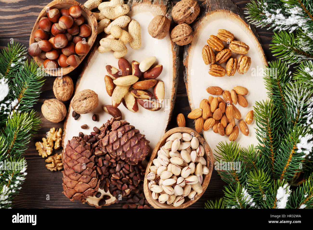 Various nuts on wooden table. Top view Stock Photo - Alamy