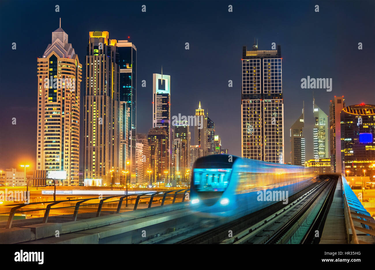 Self-driving metro train with skyscrapers in the background - Dubai ...