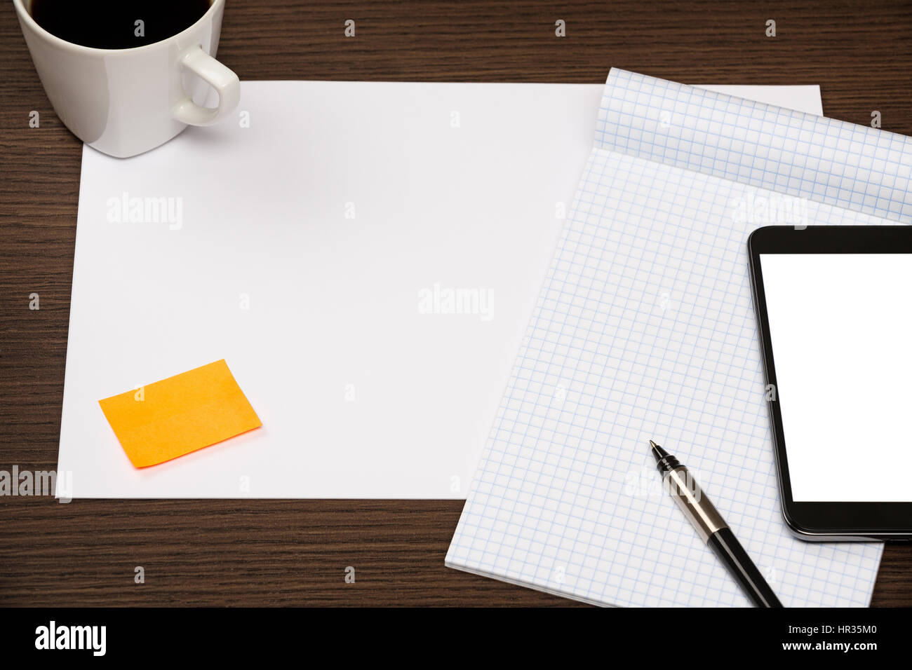 Modern smartphone with blank screen, notepad, sheet of paper, sticky ...