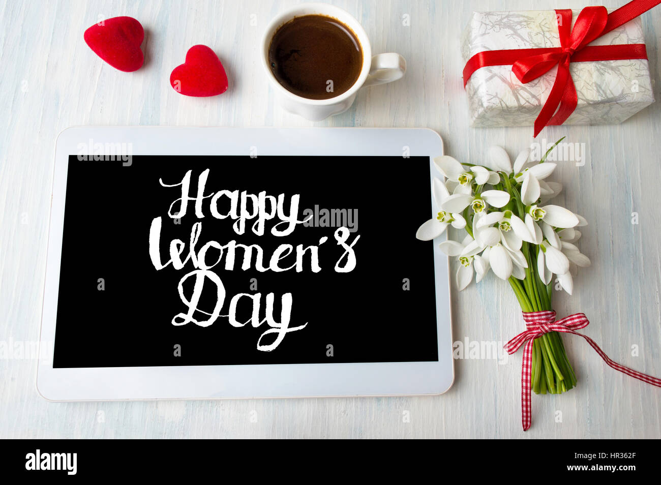 Happy womens day calligraphy note on a white tablet Stock Photo - Alamy