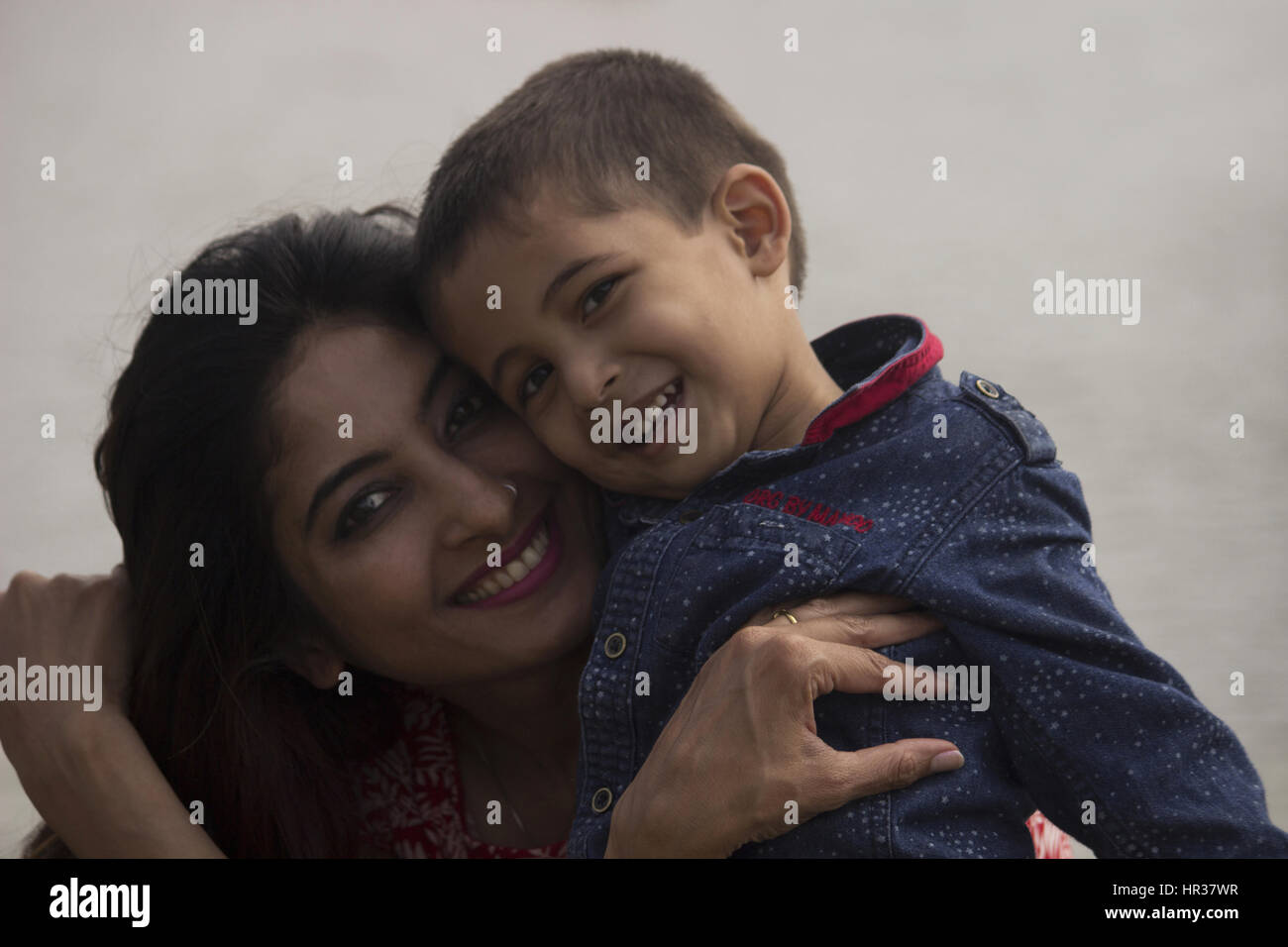 Indian son hugging mother hi-res stock photography and images - Alamy