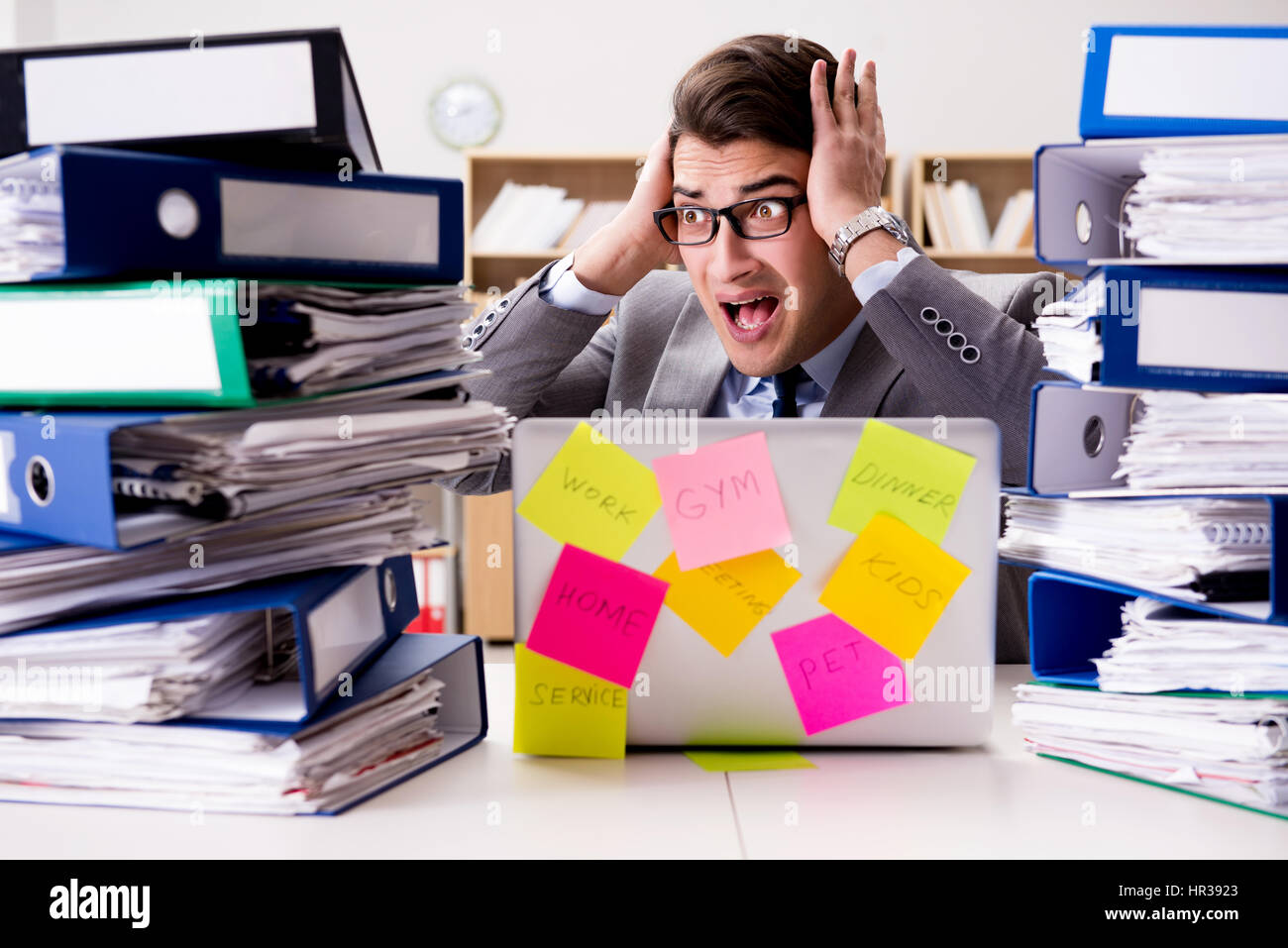 Businessman struggling with multiple priorities Stock Photo - Alamy