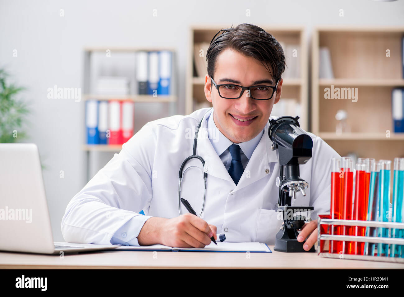Man doctor working in the lab Stock Photo - Alamy