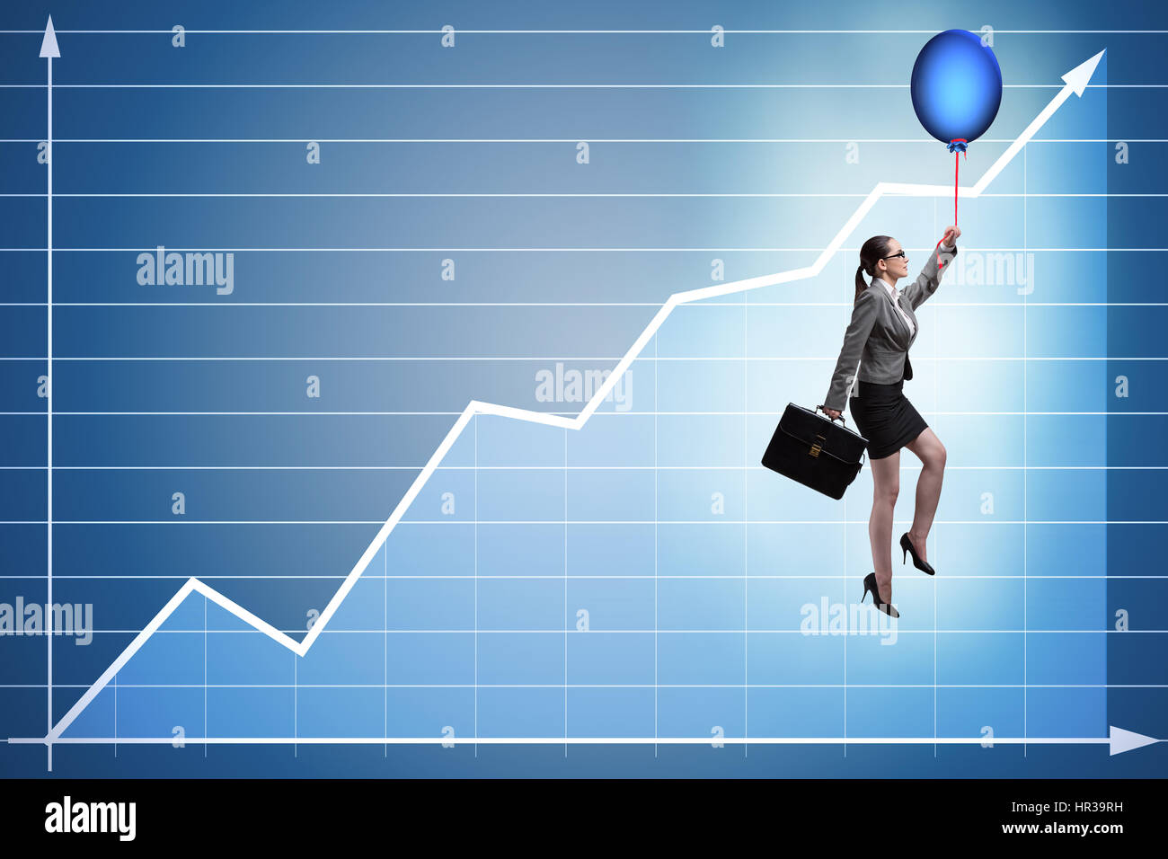 Businesswoman flying on hot balloon over graph Stock Photo - Alamy