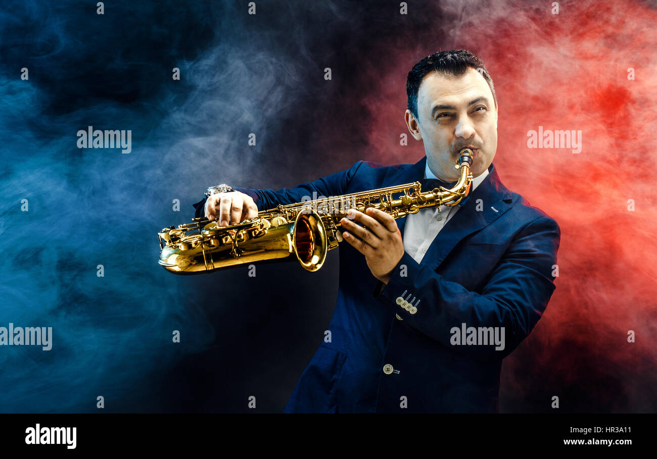 Stylish man playing saxophone hi-res stock photography and images - Alamy