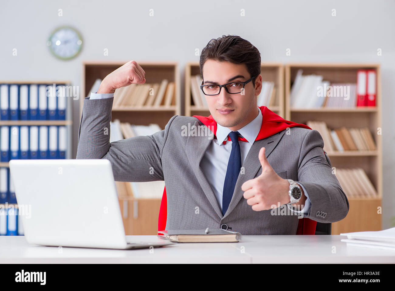 Superhero businessman working in the office Stock Photo - Alamy