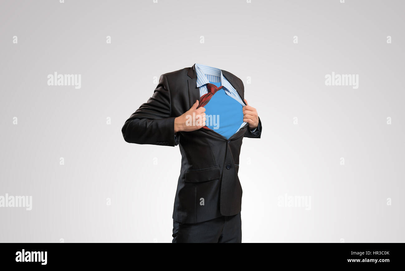 Headless businessman in black suit acting like super hero Stock Photo ...