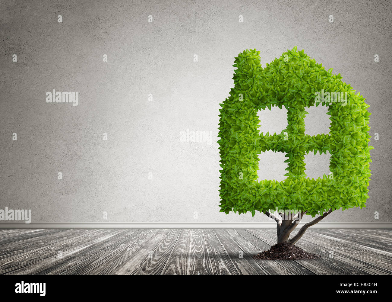 House shaped green tree as real estate concept Stock Photo - Alamy