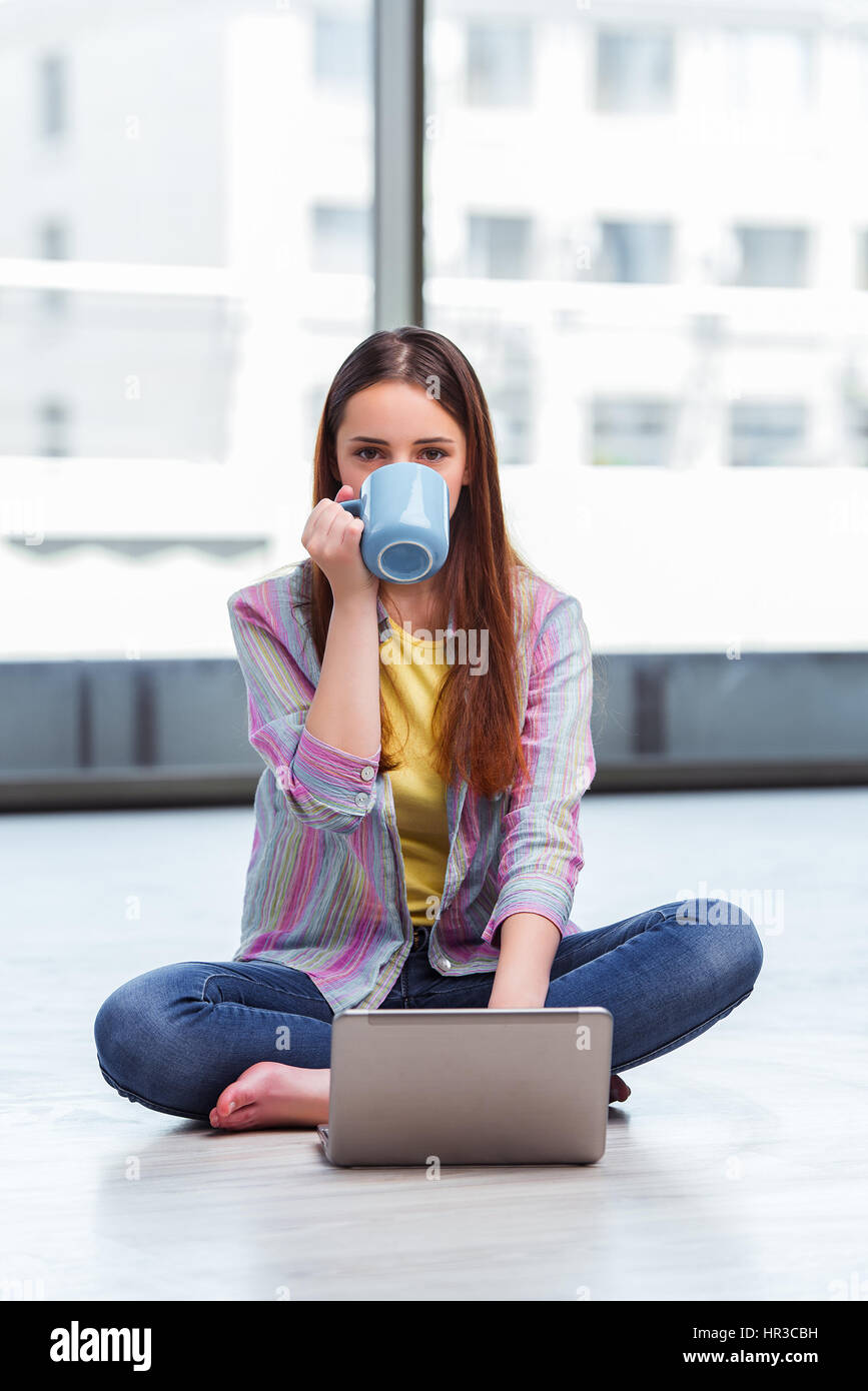 Young girl surfing internet on laptop Stock Photo - Alamy