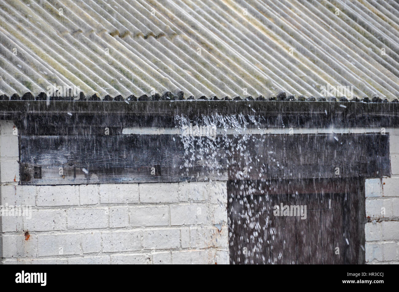 Rain pouring off roof hi-res stock photography and images - Alamy