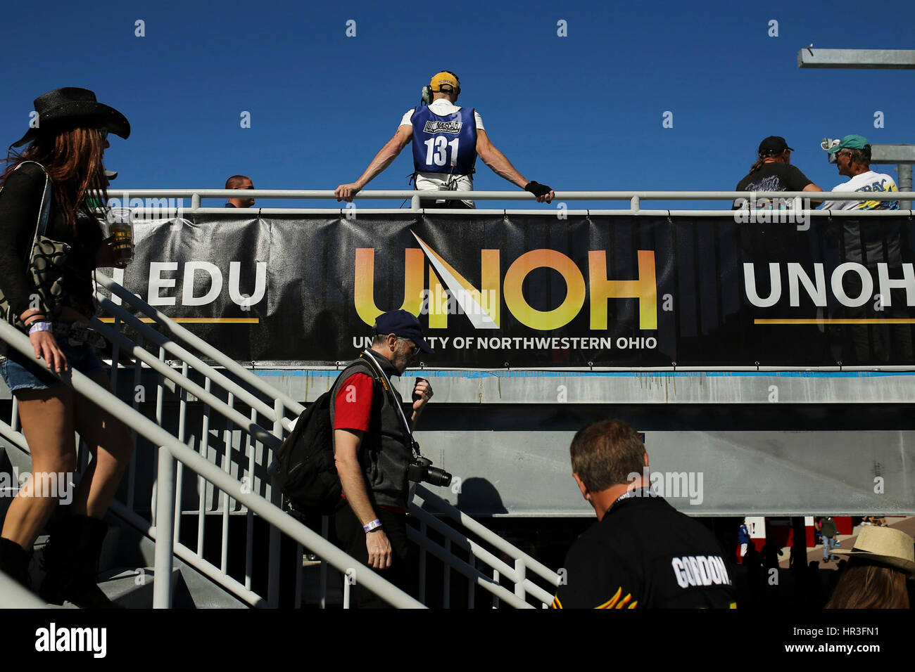 Florida, USA. 26th Feb, 2017. CHARLIE KAIJO | Times.NASCAR fans walk ...