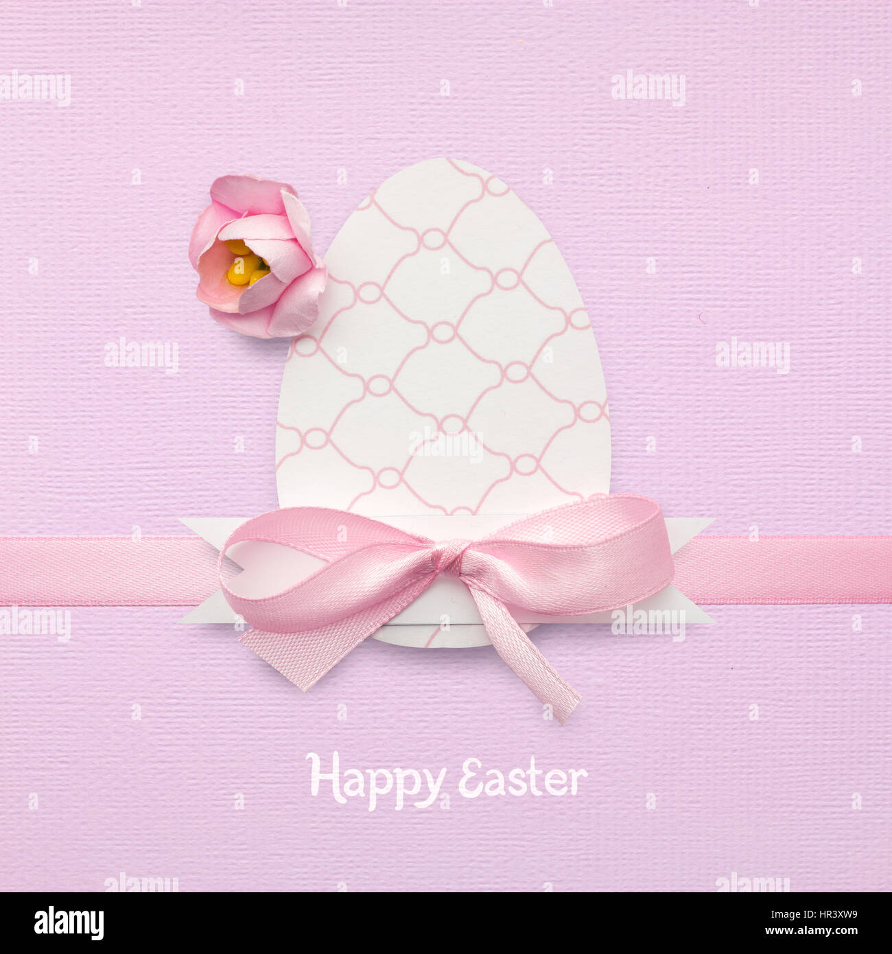 Creative easter concept photo of an egg made of paper on pink ...