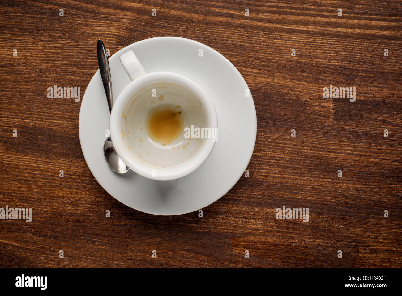 Empty coffee cup after drink on wood table. Top view Stock Photo - Alamy