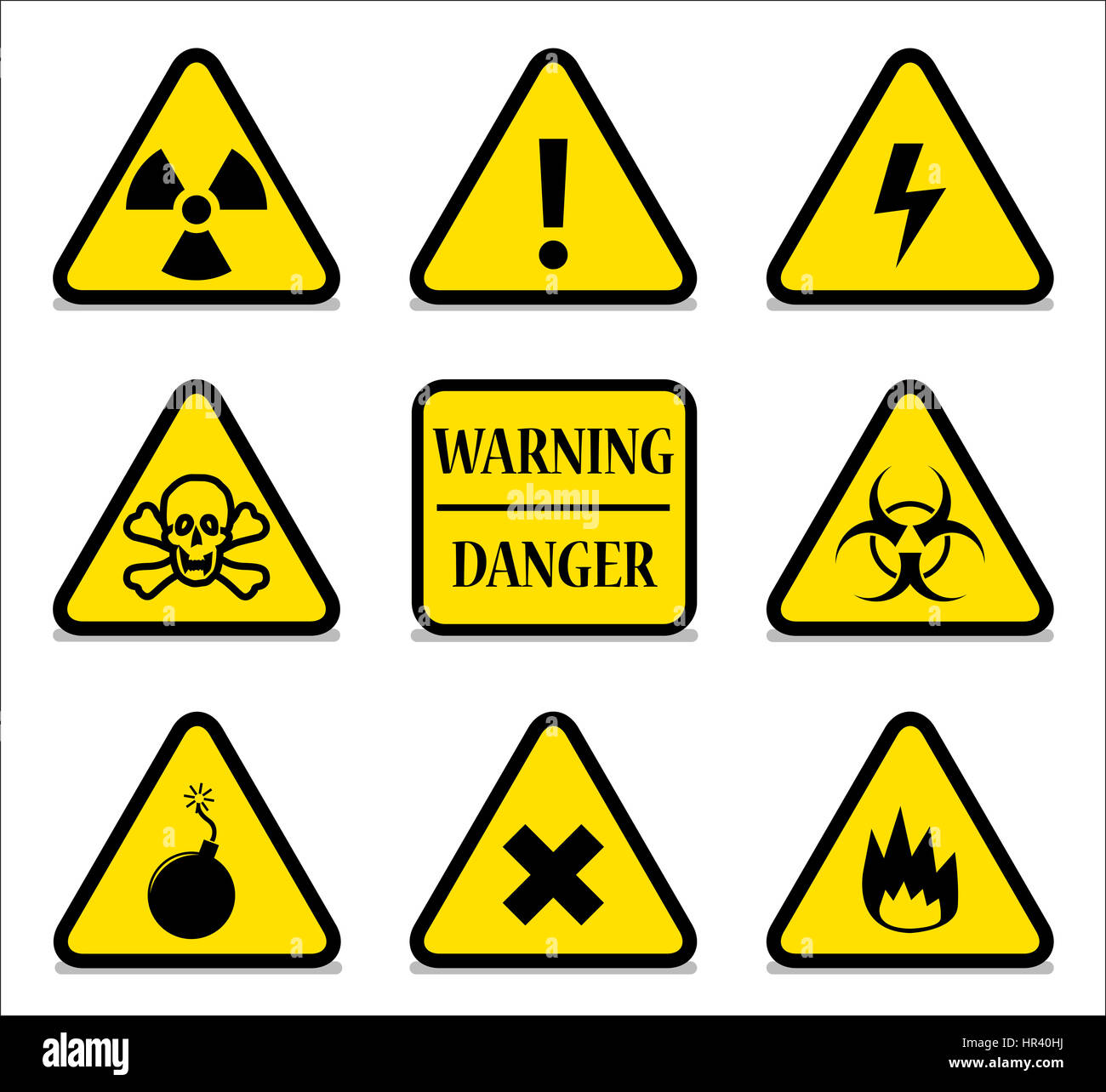 A selection of yellow triangular hazard signs isolated on a white ...