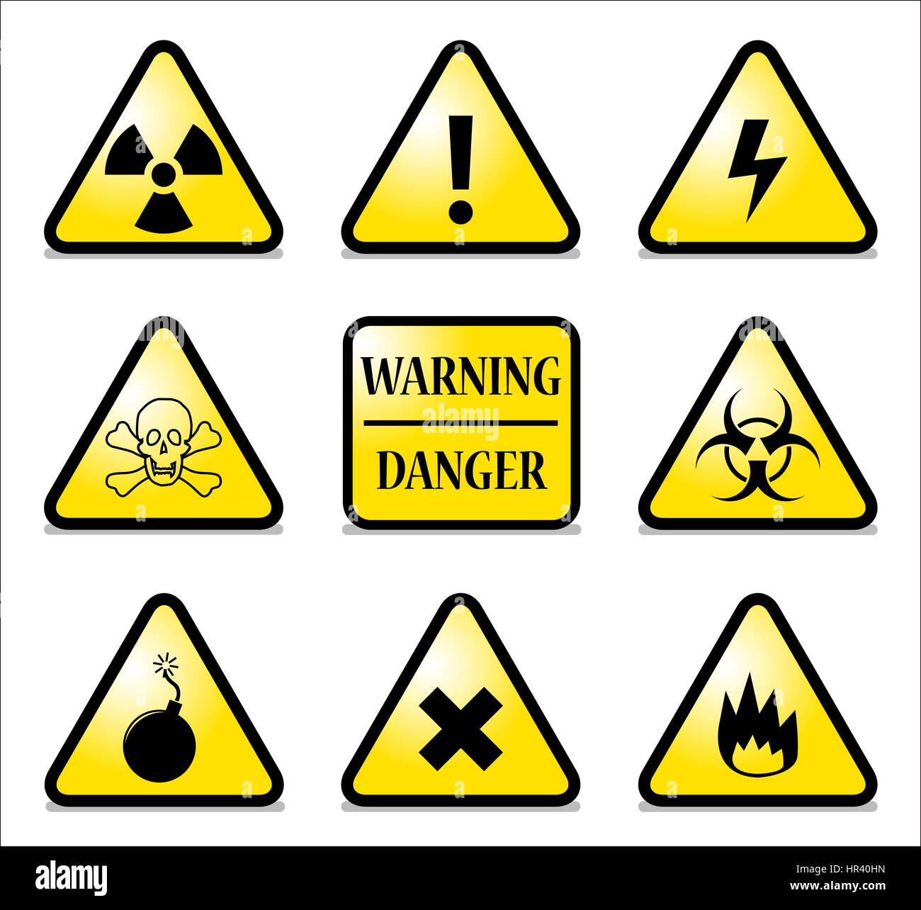 A selection of yellow triangular hazard signs isolated on a white ...
