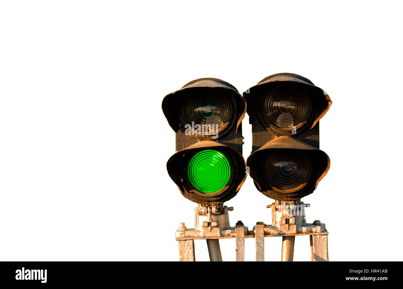 Traffic light shows green signal on railway isolated on white ...