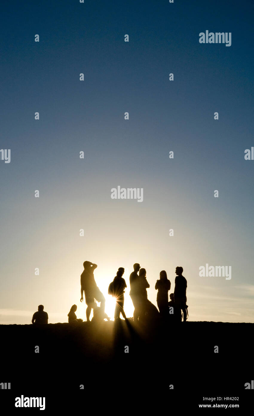 Silhouette people watching sunset hi-res stock photography and images ...
