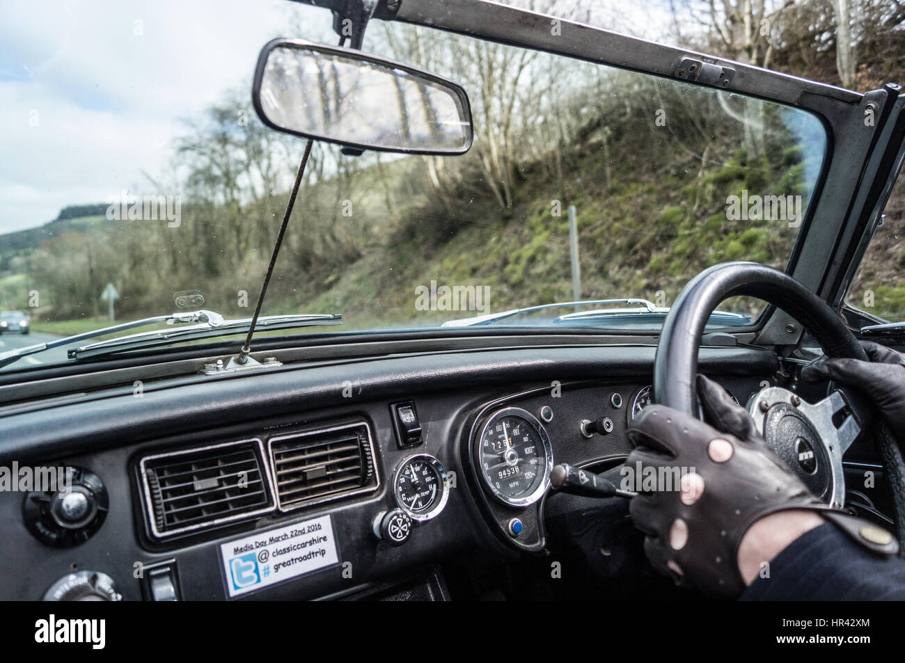 Driving in a classic car. Windscreen steering wheel view Stock Photo ...