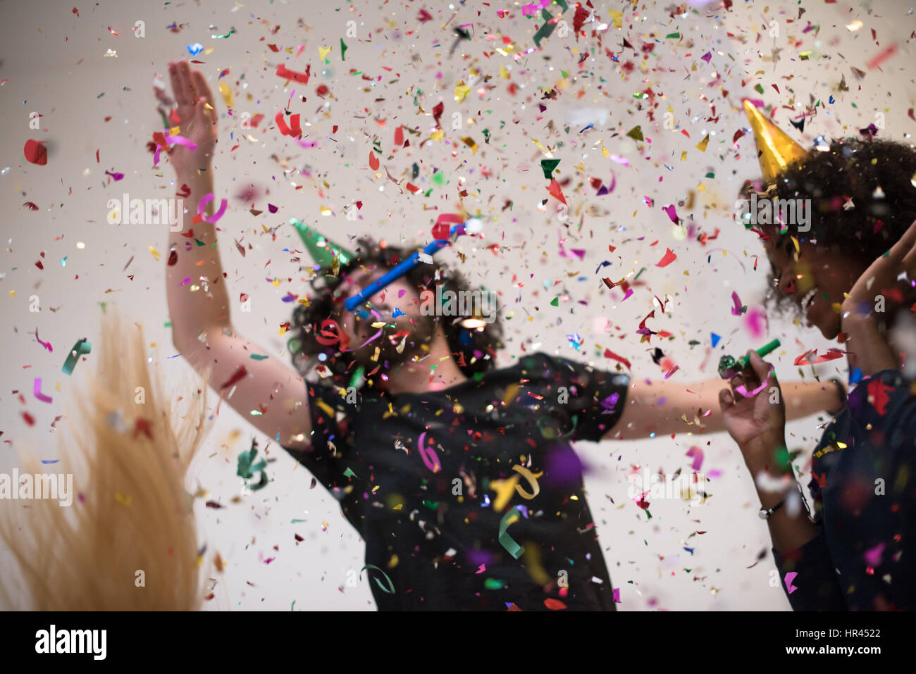 confetti party Multiethnics happy young people group celebrating new ...