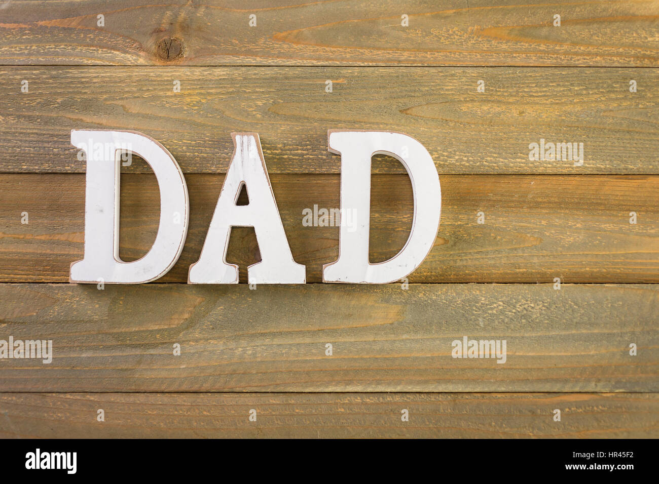 White letters DAD on a painted wood background Stock Photo - Alamy